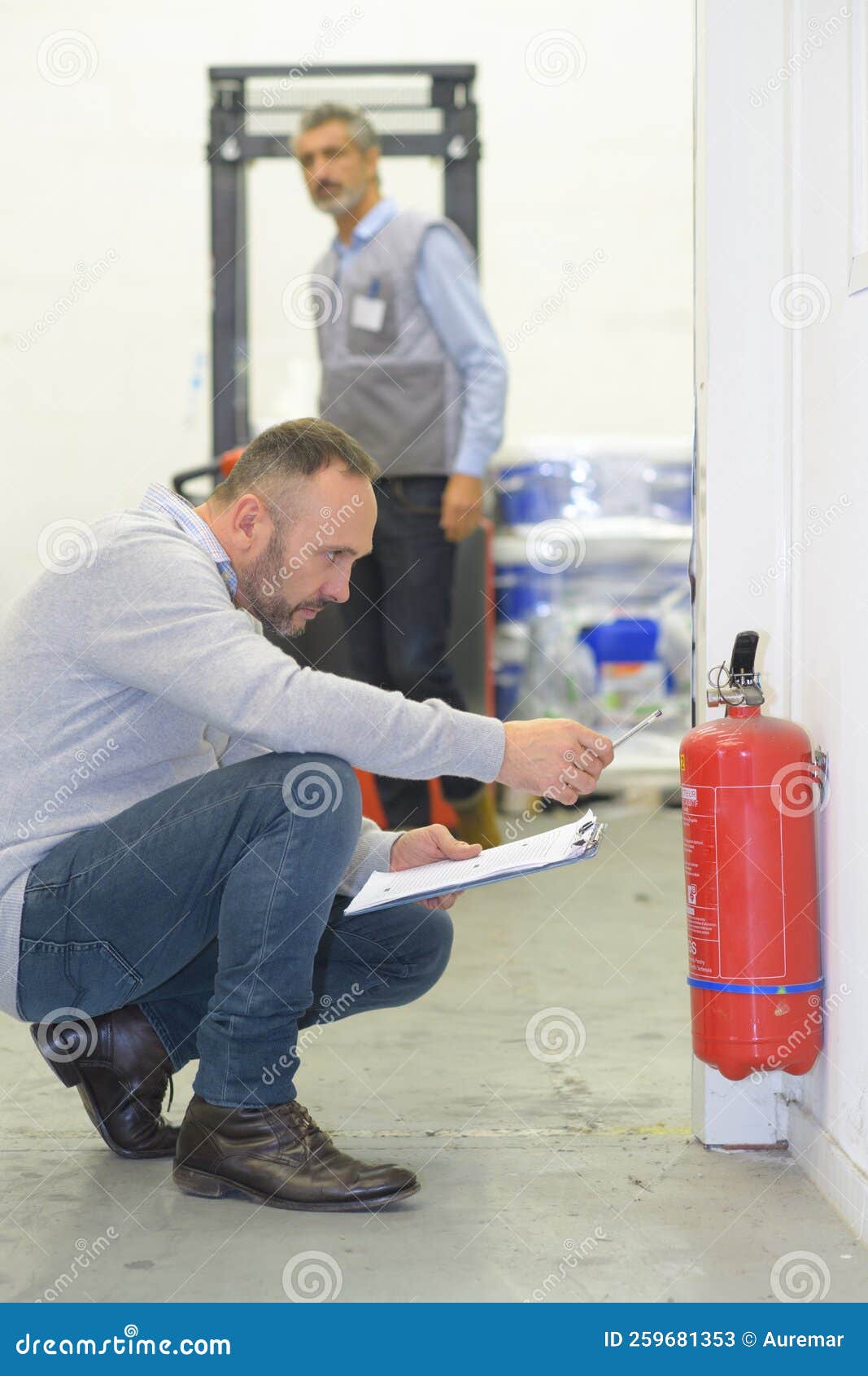 Inspecting the Fire Extinguisher Stock Image - Image of function ...