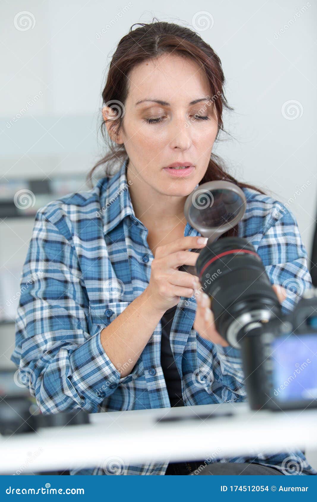 She inspecting lens stock photo. Image of profession - 174512054