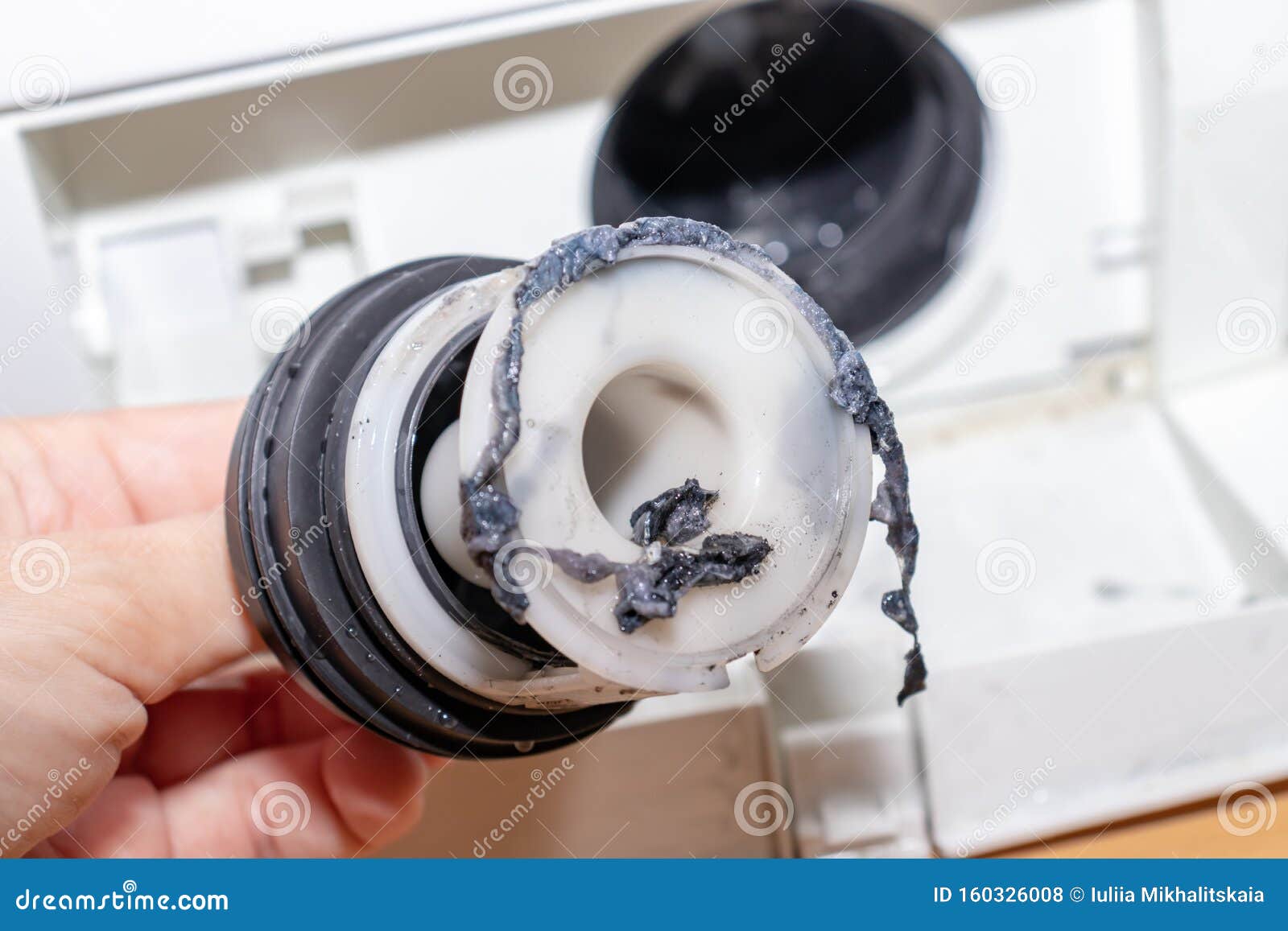 Inspecting Washing Machine`s Dirty Clogged Drain Pump Filter Close Up ... Inspecting Washing Machine`s Dirty Clogged Drain Pump Filter Close Up ...