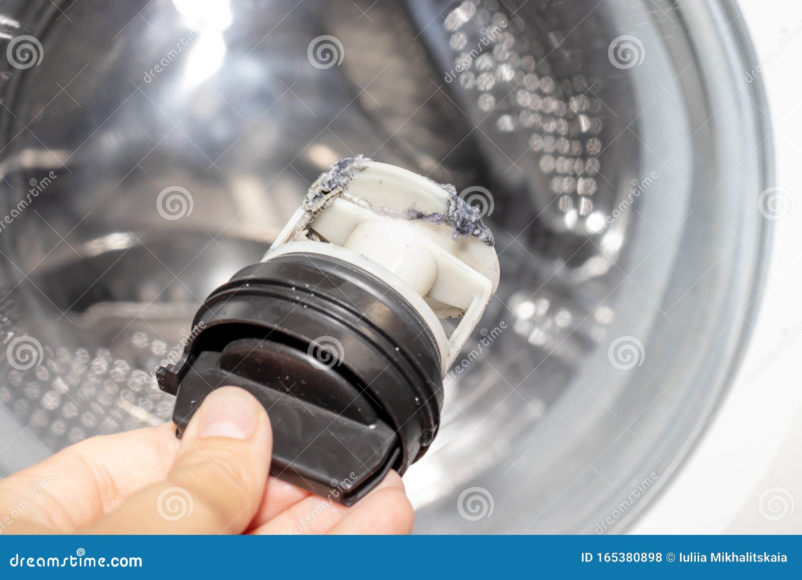 Inspecting Washing Machine`s Dirty Clogged Drain Pump Filter Close Up ... Inspecting Washing Machine`s Dirty Clogged Drain Pump Filter Close Up ...