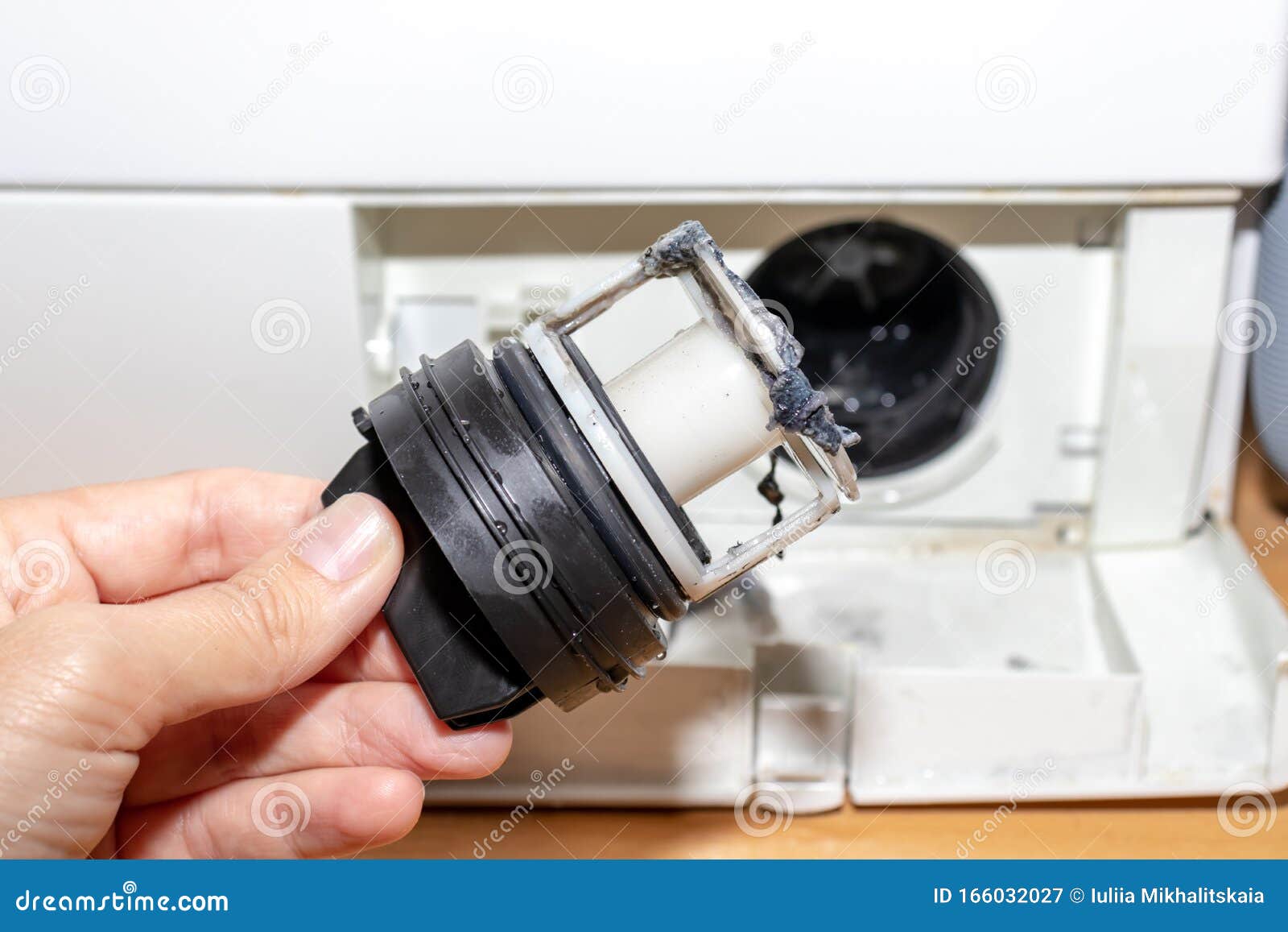 Inspecting Washing Machine`s Dirty Clogged Drain Pump Filter Close Up ... Inspecting Washing Machine`s Dirty Clogged Drain Pump Filter Close Up ...