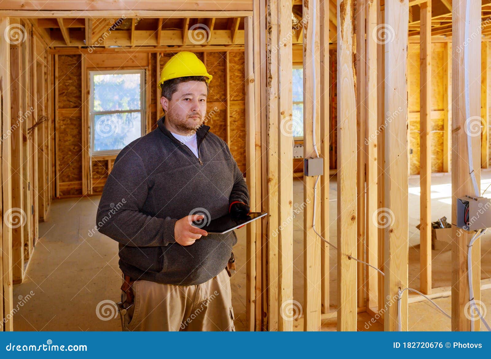 Inspector Checking Building during House Construction on Tablet PC with ...