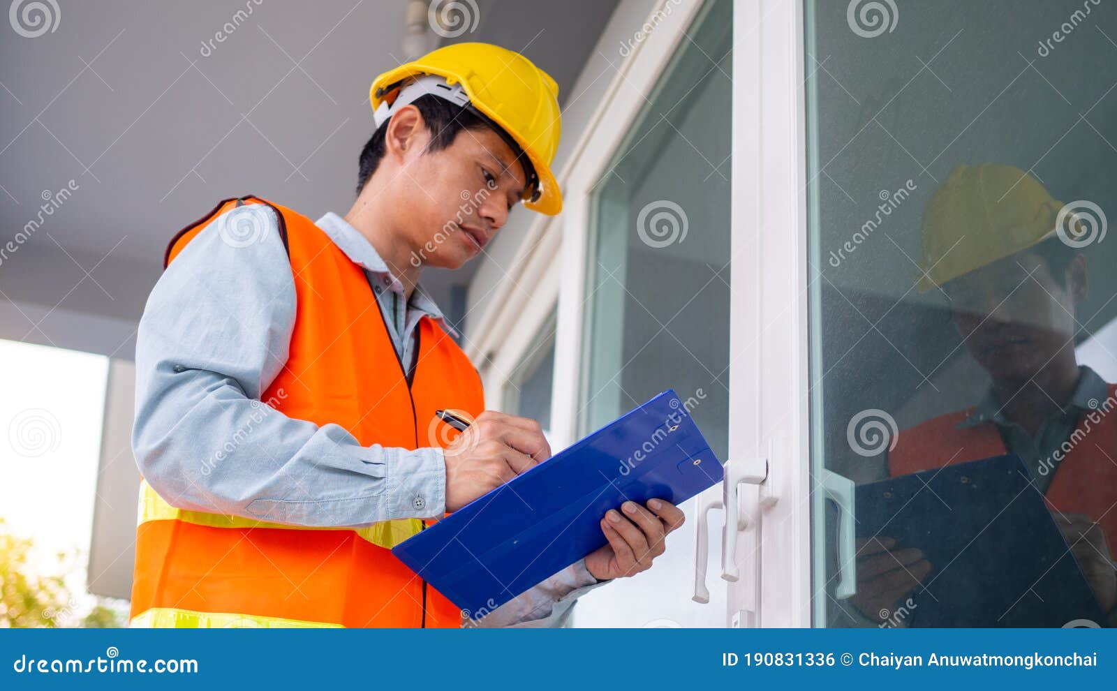 The Inspector or Engineer is Checking the Building Structure and Door ...