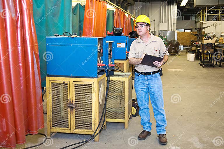Inspector on Factory Floor stock photo. Image of clipboard - 7303646