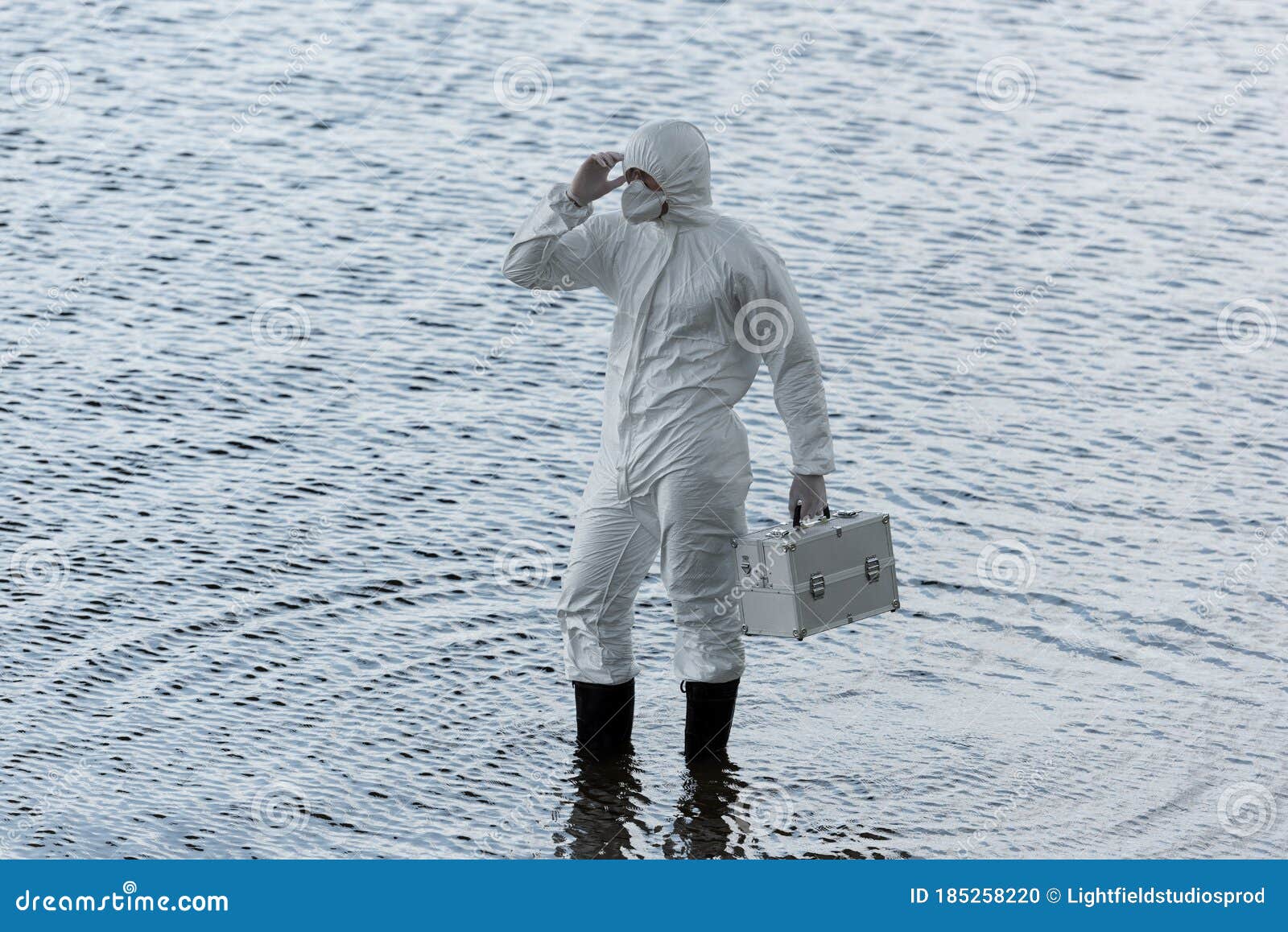 Inspector in Protective Costume Holding Inspection Kit in River Stock ...