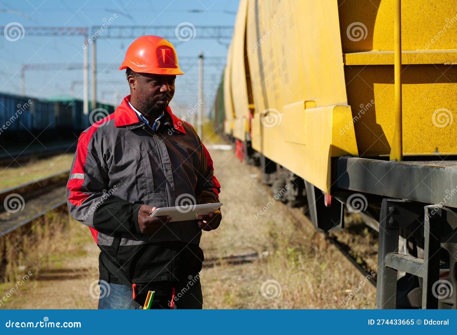 African American Railway Man with Tablet Computer at Freight Train ...