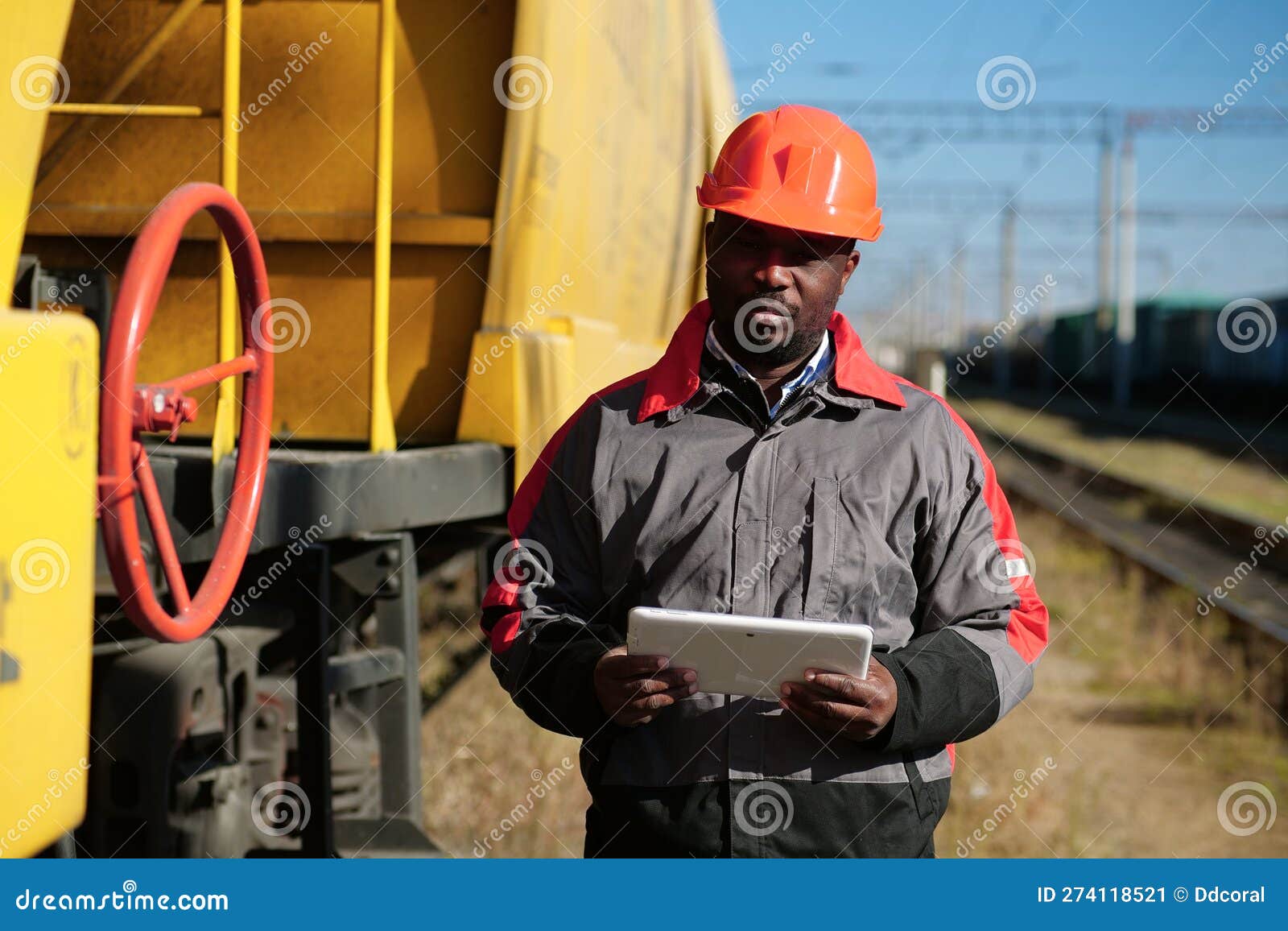 Inspector of Wagons at Freight Train Station with Tablet Computer Stock ...