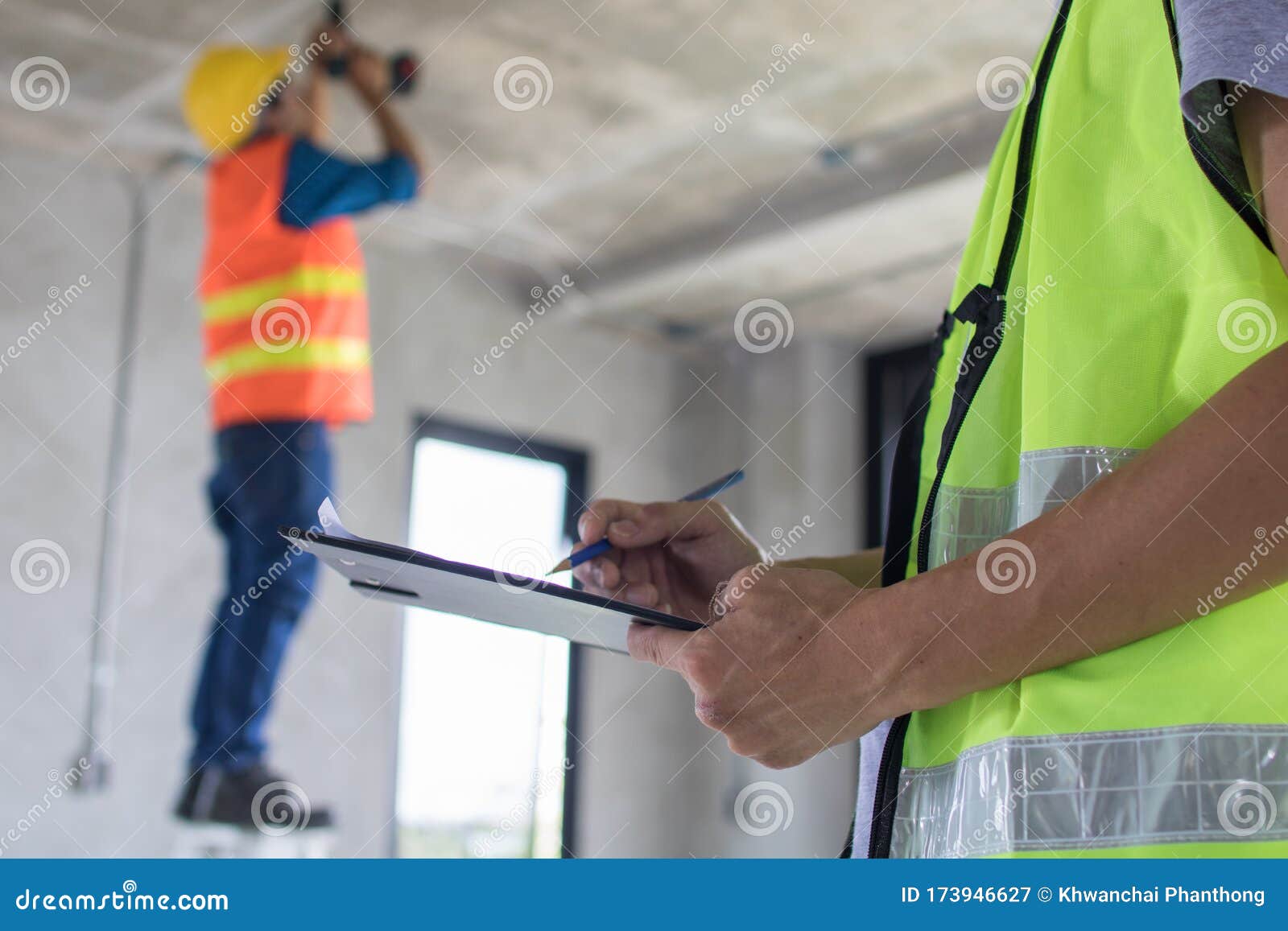Inspector Worker Working and Checking on Paper, Inspecting Build in ...