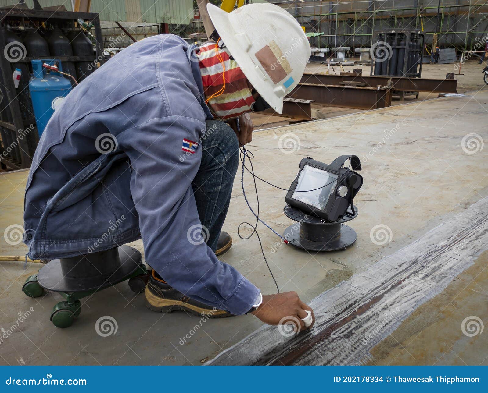 The Inspectors Are Checking Defect In Welded Of Steel Add Joint With ...