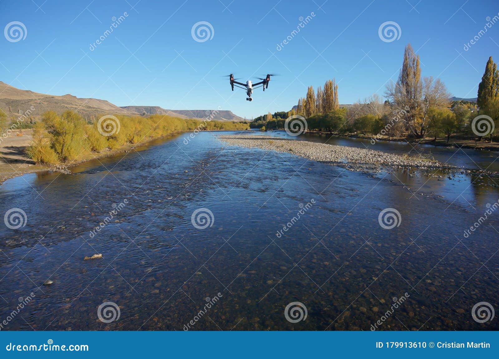 Inspire Quadcopter Drone Flying Over River. Front View Stock Photo ...