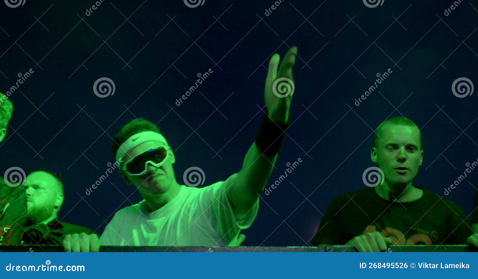 Inspired People Dance. they Move Their Hands. Using Glasses Against the ...