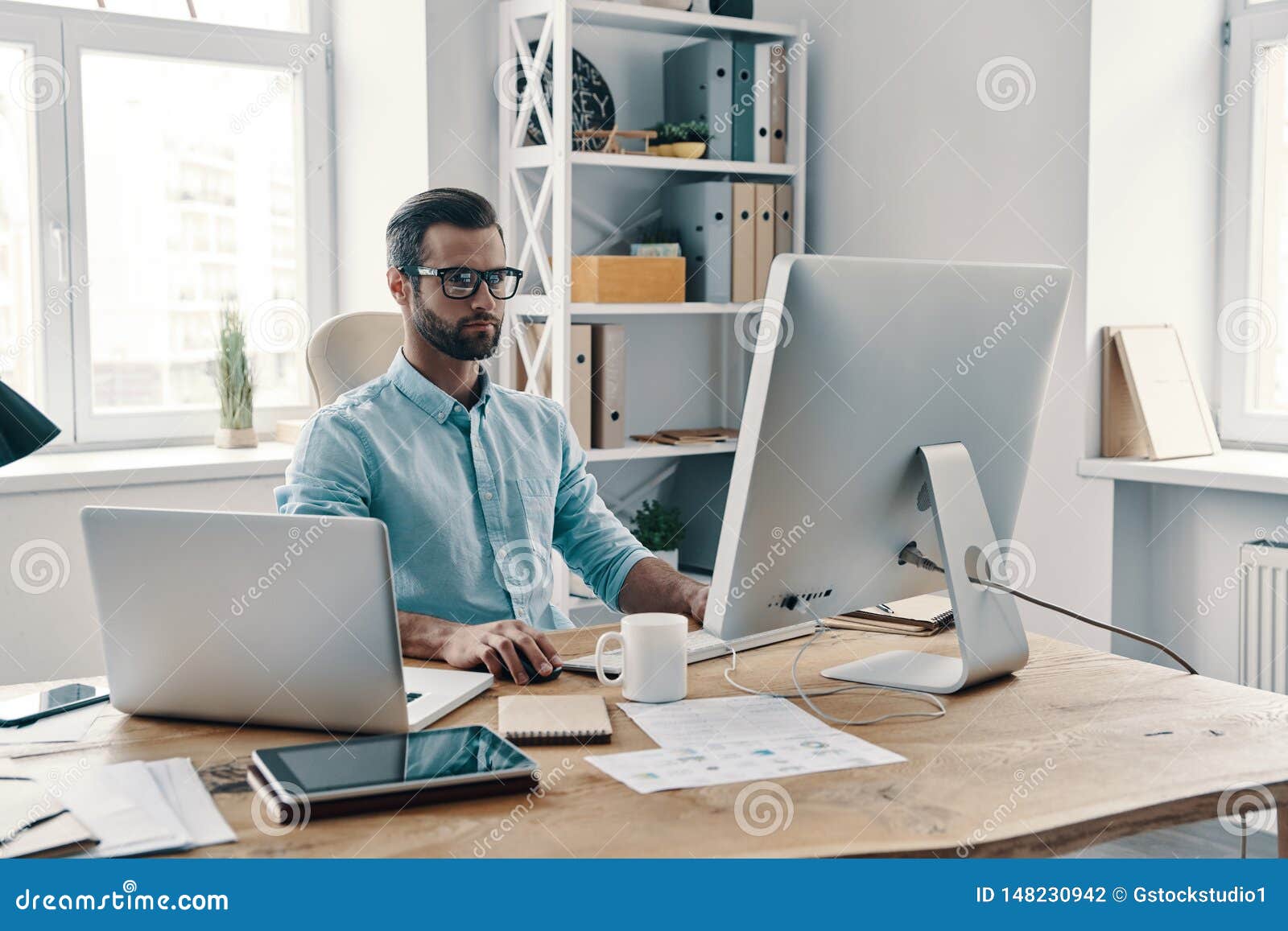 Inspired to work hard. stock photo. Image of people - 148230942