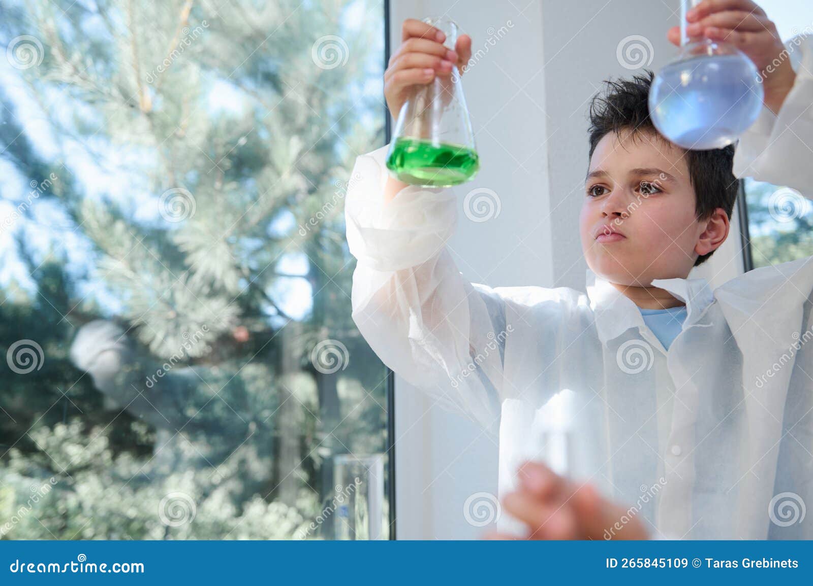 Inspired Young Chemist, Smart Nerd Schoolboy Examining Solutions in the ...