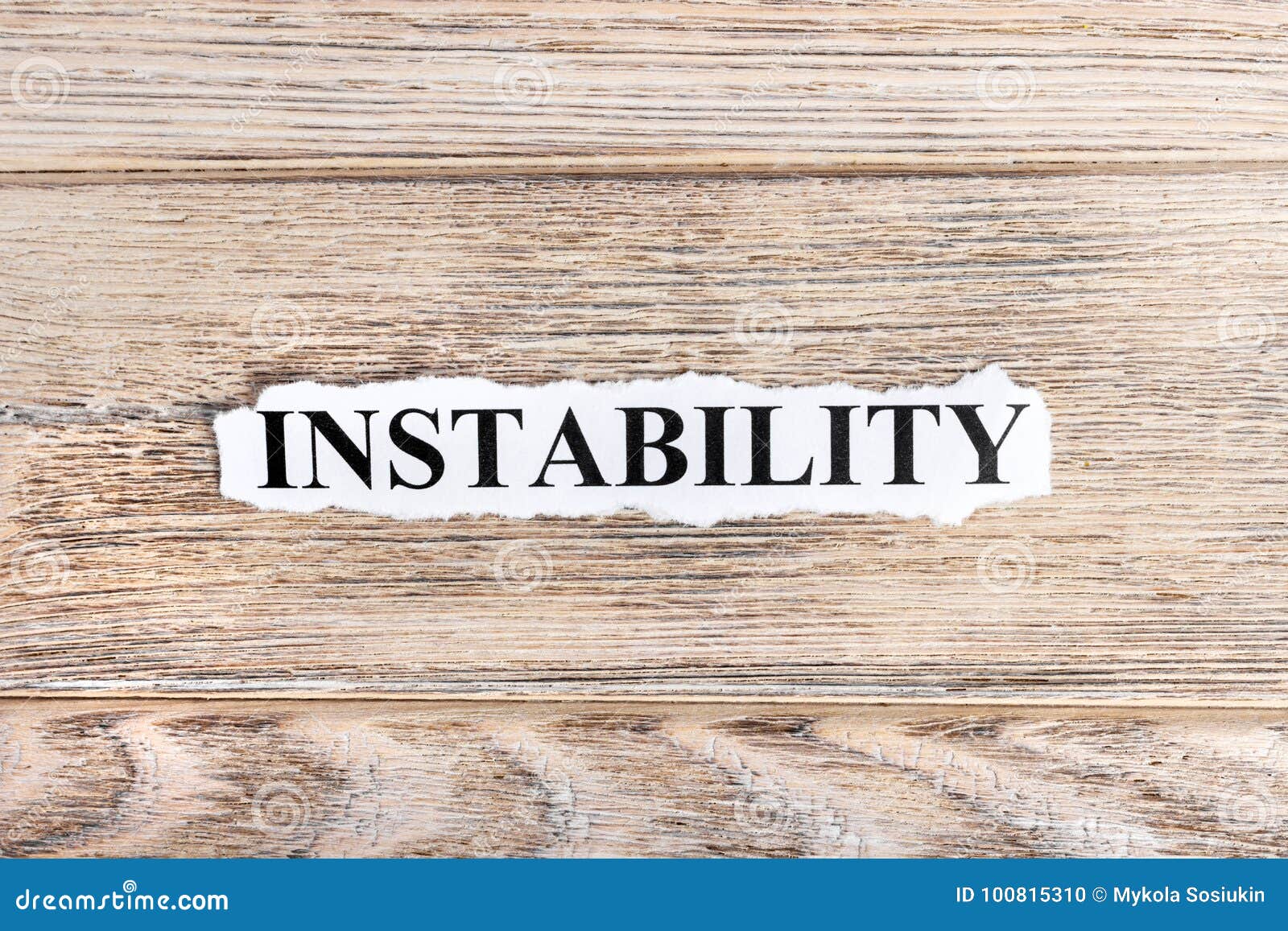 INSTABILITY Text on Paper. Word INSTABILITY on Torn Paper Stock Photo ...