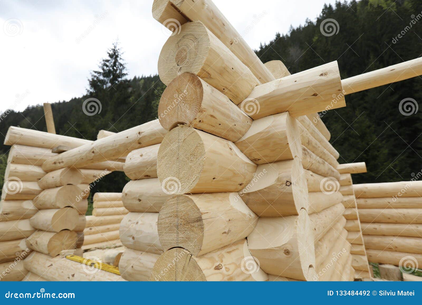 Assembly of a Wooden Log House on Construction Site. Stock Photo ...
