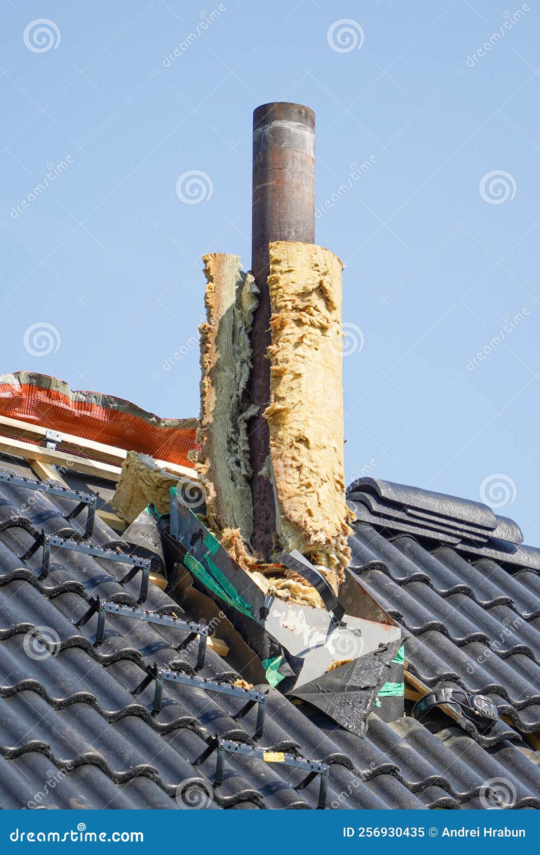 Installation of Chimney with Exposed Isolation Layer on the Roof Stock ...
