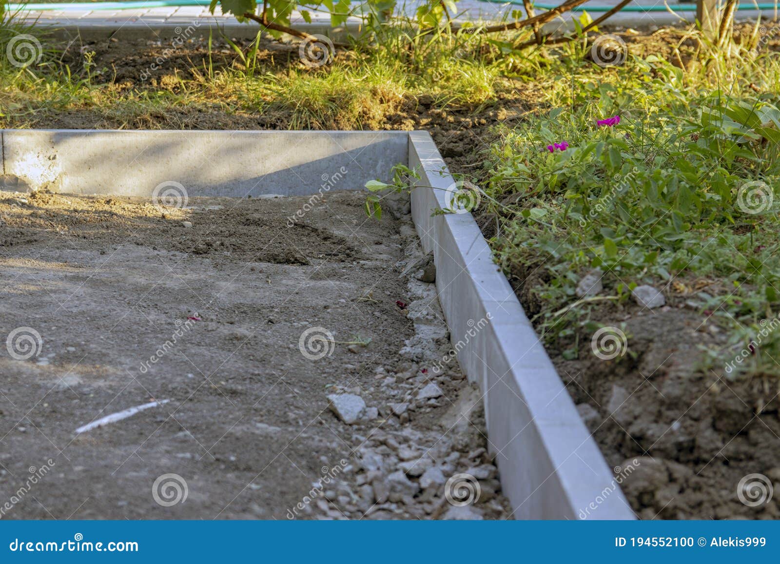 Installation of Curbs. Laying Curb Stones Using Concrete. Selective ...