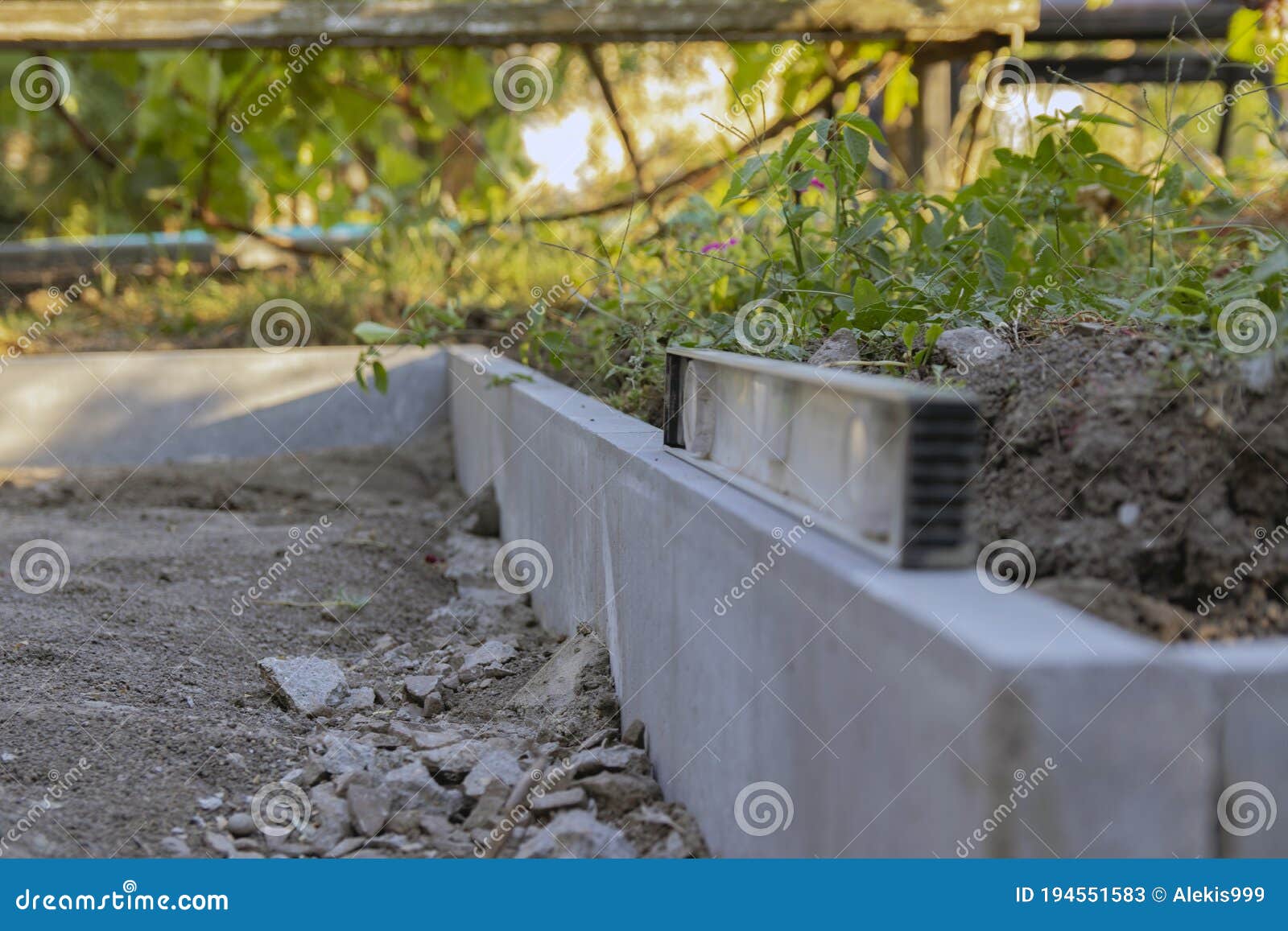 Installation of Curbs. Laying Curb Stones Using Concrete. Selective ...