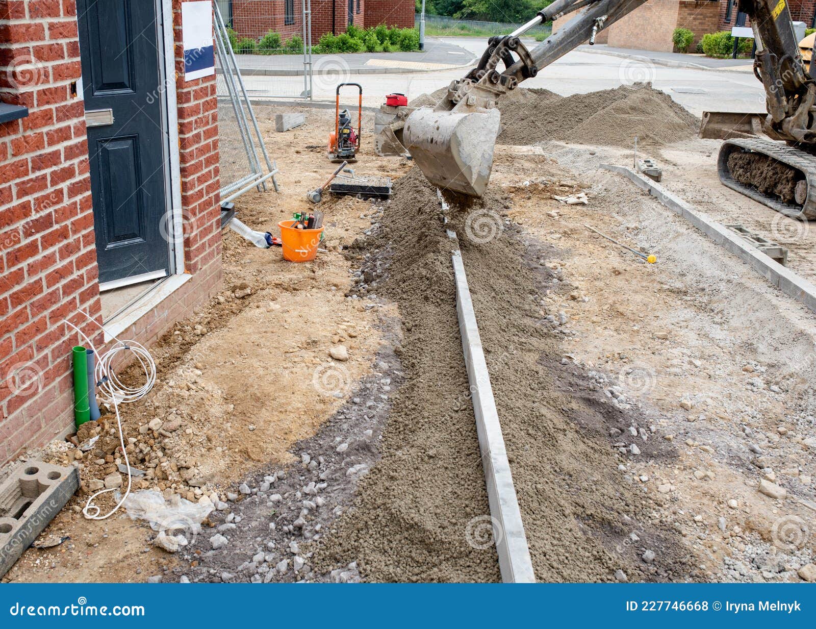 Installation Of Edging Pin Kerb On Semi-dry Concrete During Footpath ...