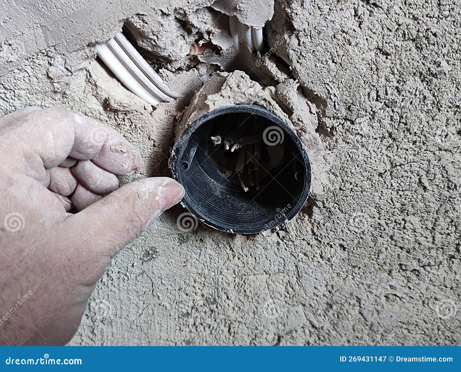 Installation of an Electrical Outlet in a Concrete Wall Close-up Stock ...