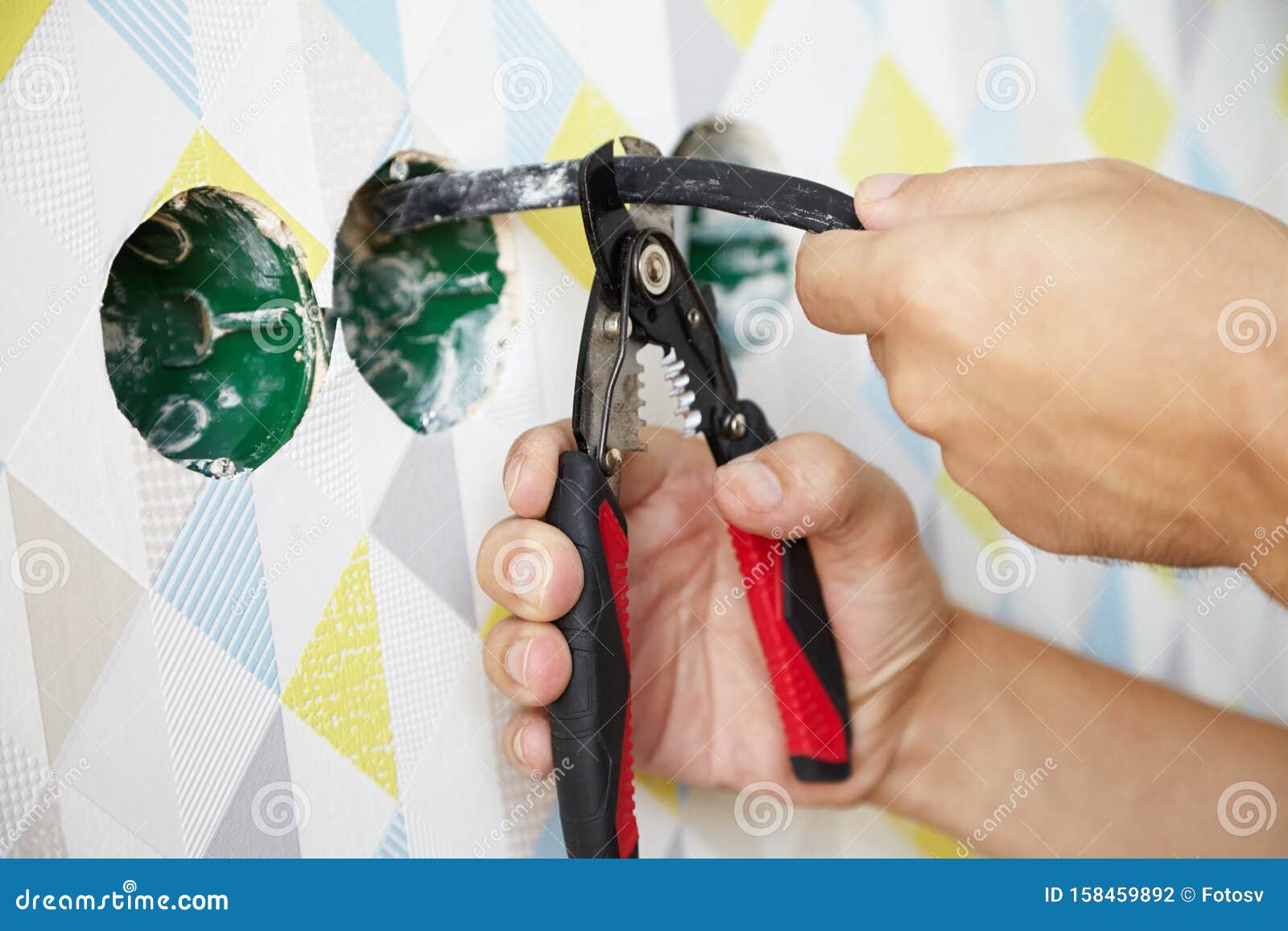 Installation of an Electrical Outlet, Work with an Electric Cable Stock ...