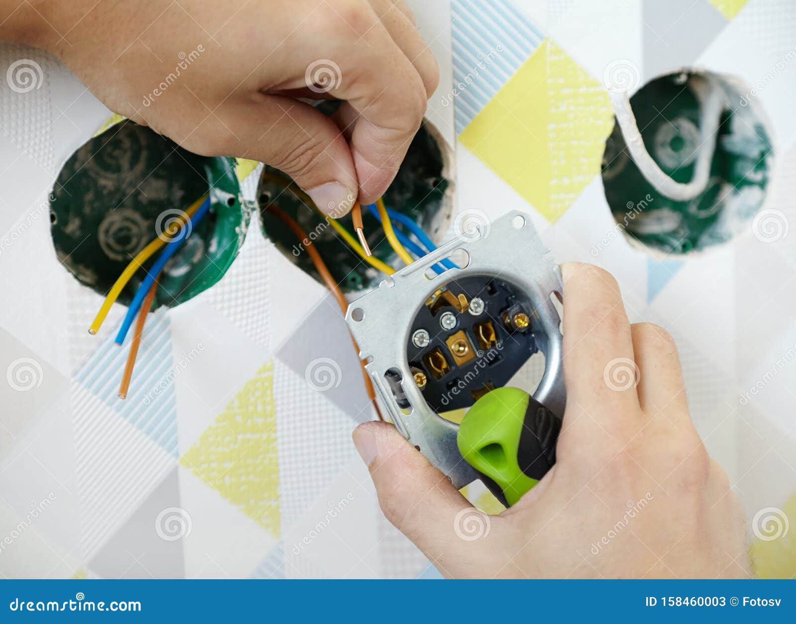 Installation of an Electrical Outlet, Work with an Electric Cable Stock ...