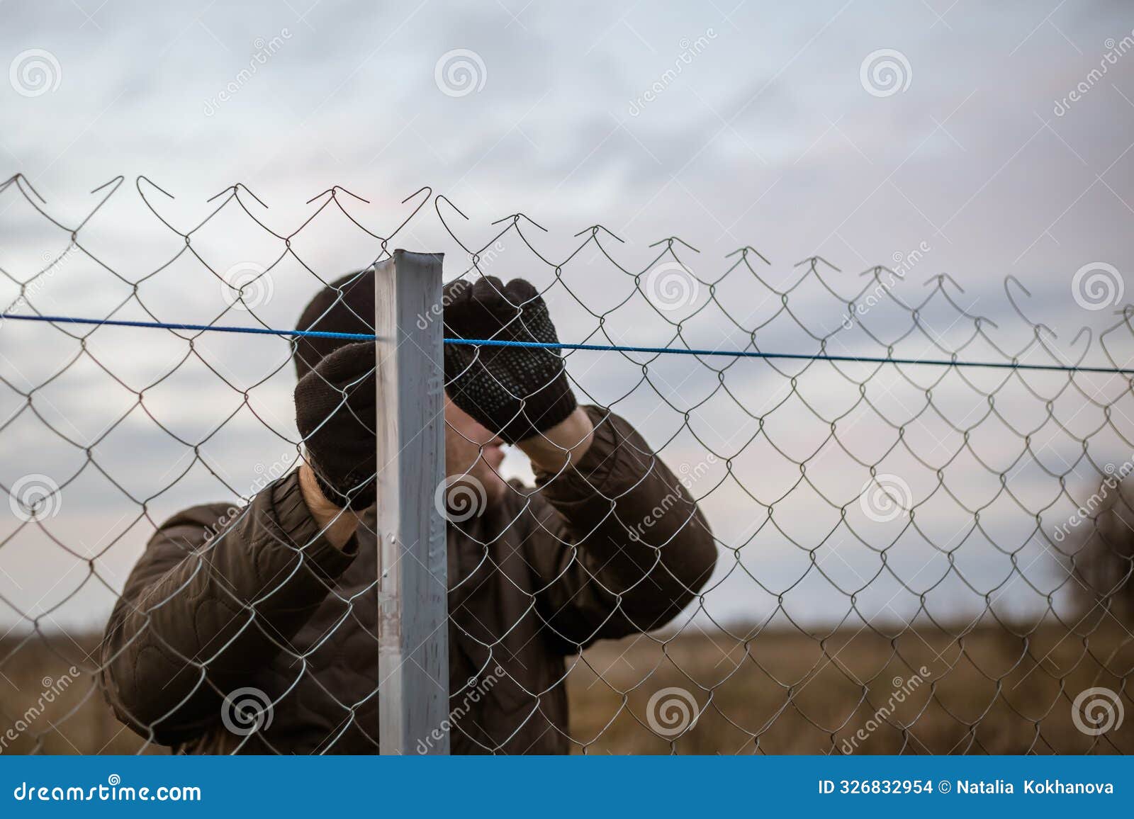Installation Of Galvanized Metal Mesh Chain-link At The Border Of The ...