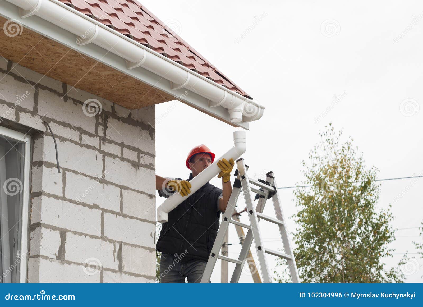 Installation gutter system stock photo. Image of contractor - 102304996