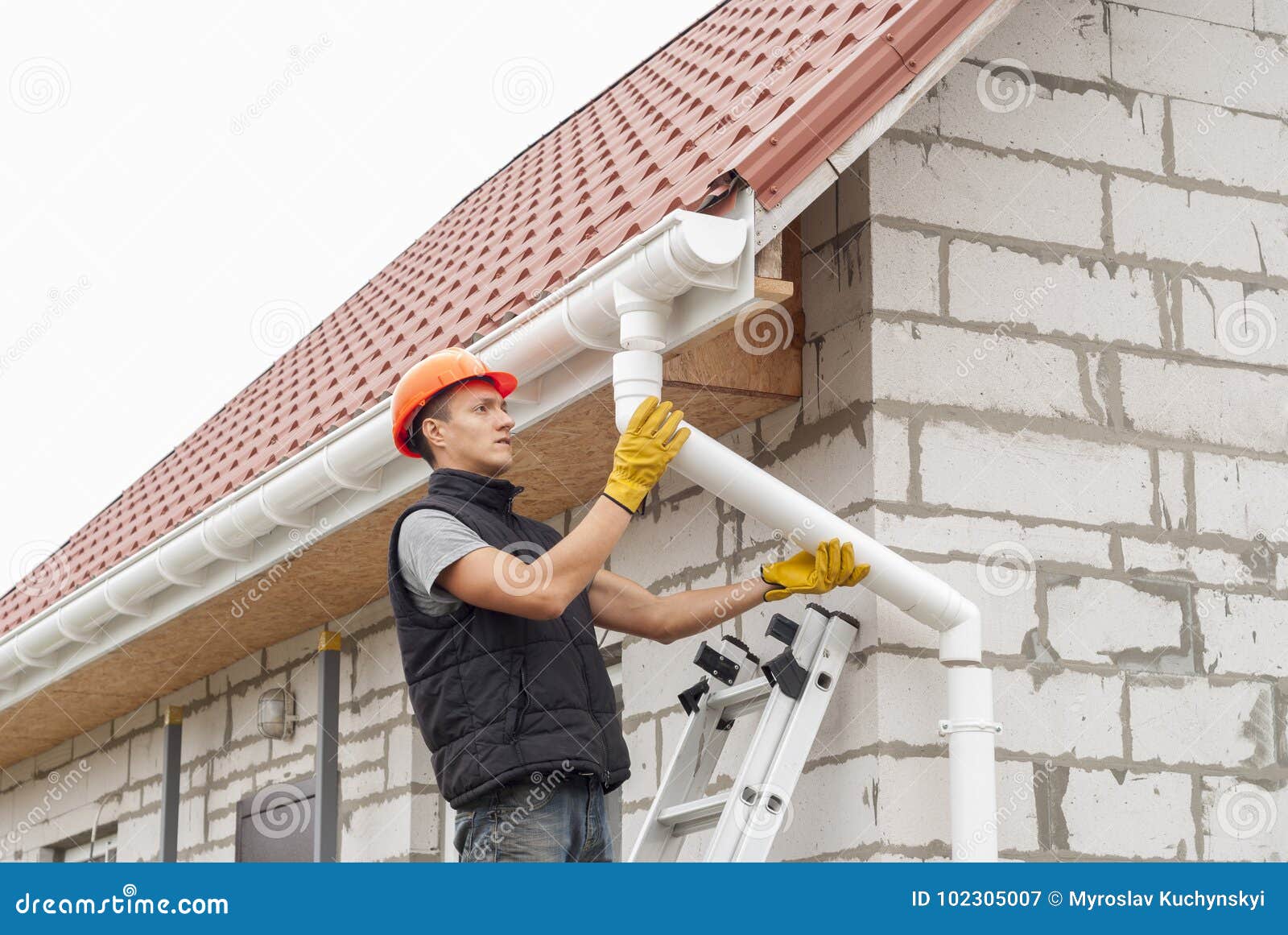 Installation gutter system stock image. Image of person - 102305007