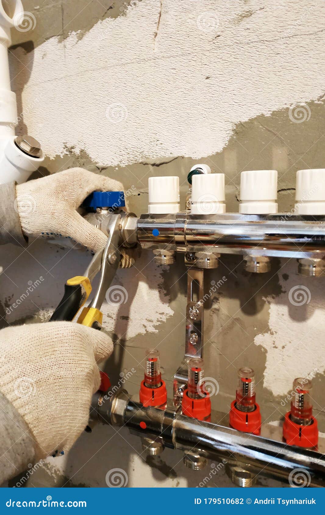 Installation of Heating a New Home, the Worker Connects the Pipe To the ...