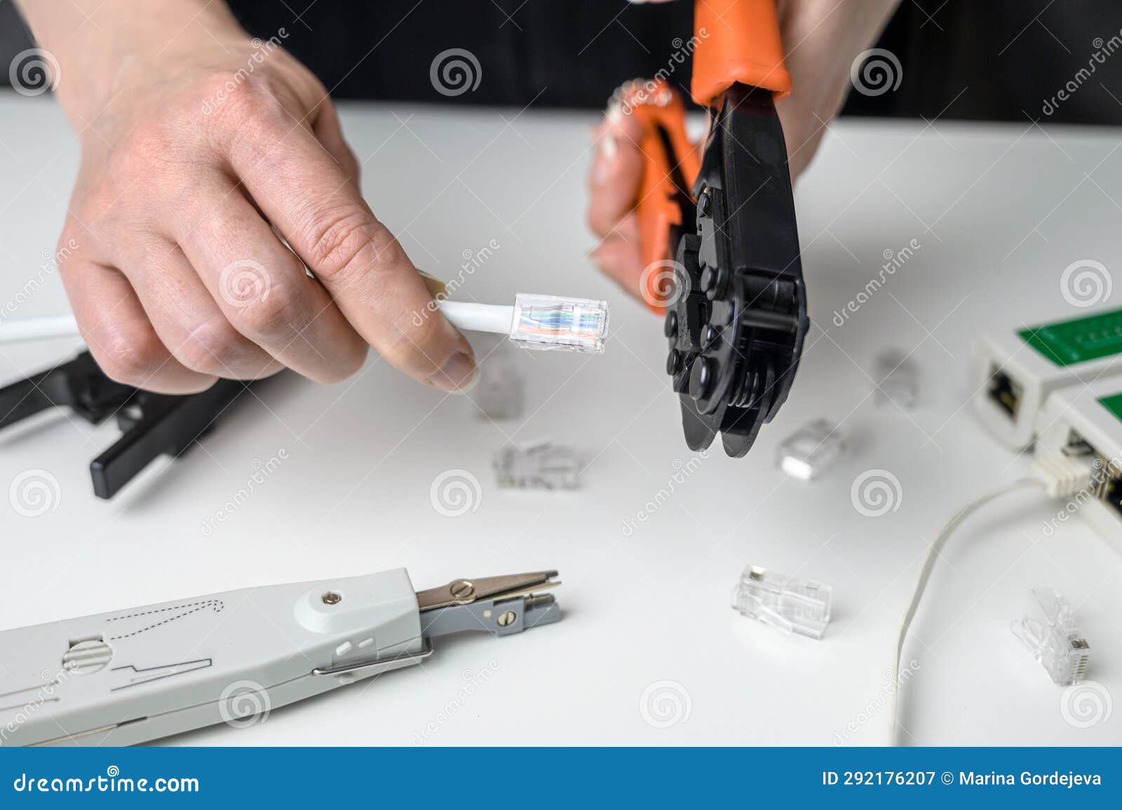 Installation of Internet or Telephone Line Cables Using a Crimping ...