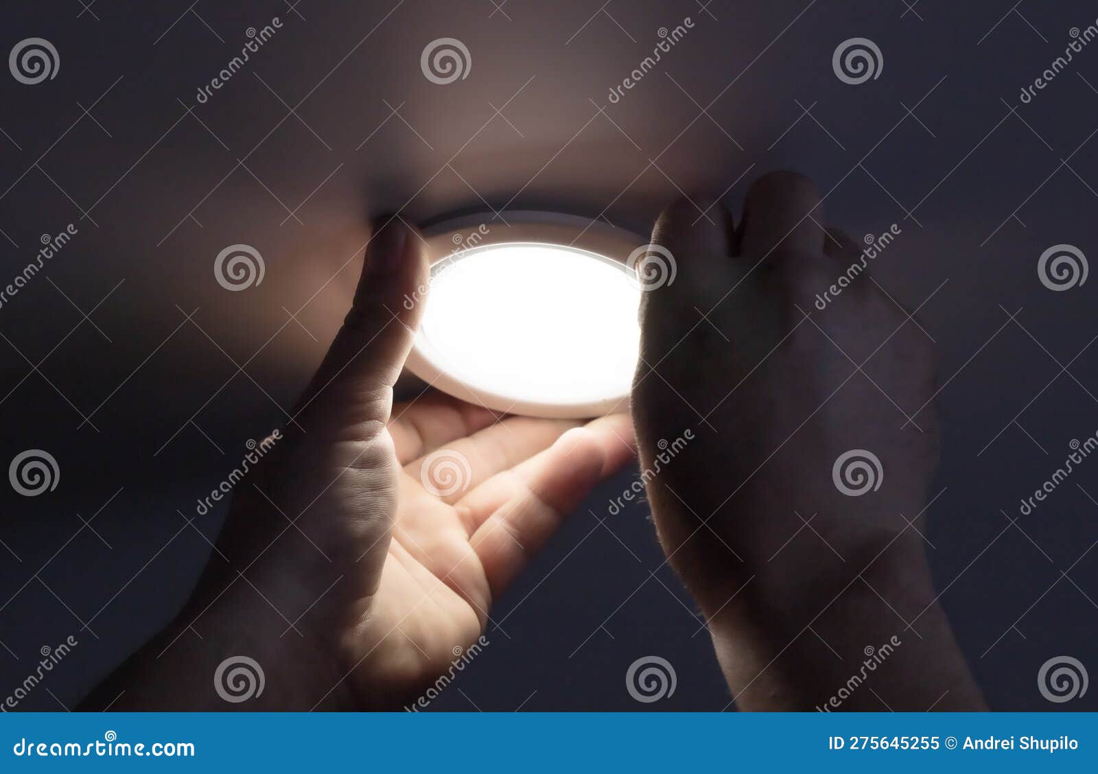 Installation of a Light Bulb in a Stretch Ceiling Stock Image - Image ...
