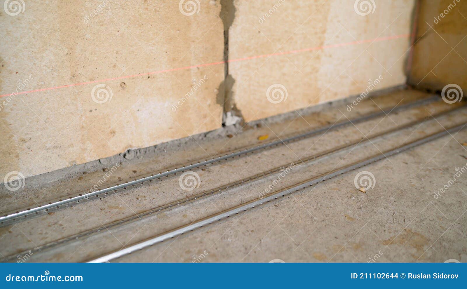 Construction Work in the Room. Installation of Metal Beacons To Level ...