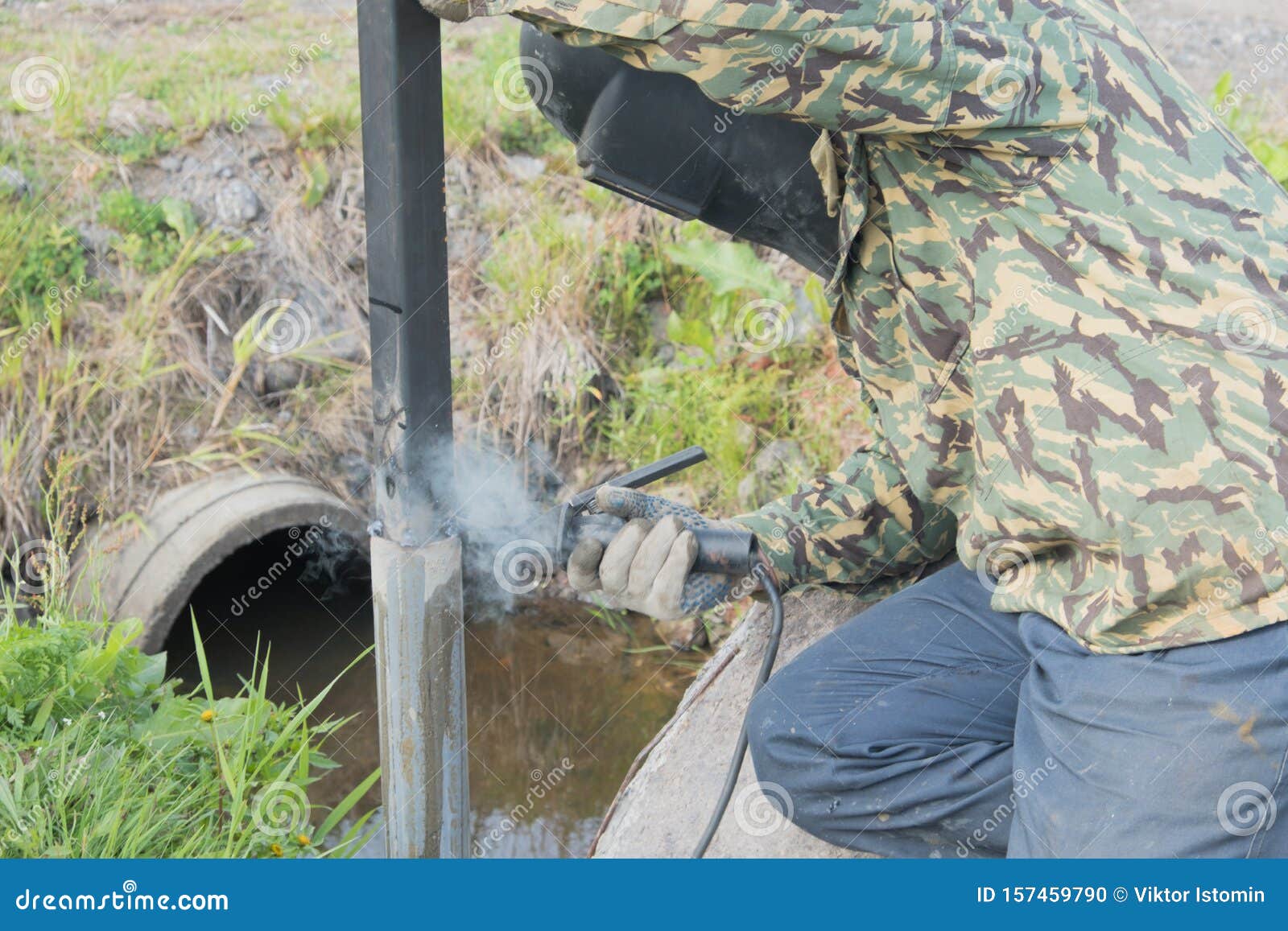 Installation of a Metal Column Using a Welding Machine Stock Photo ...