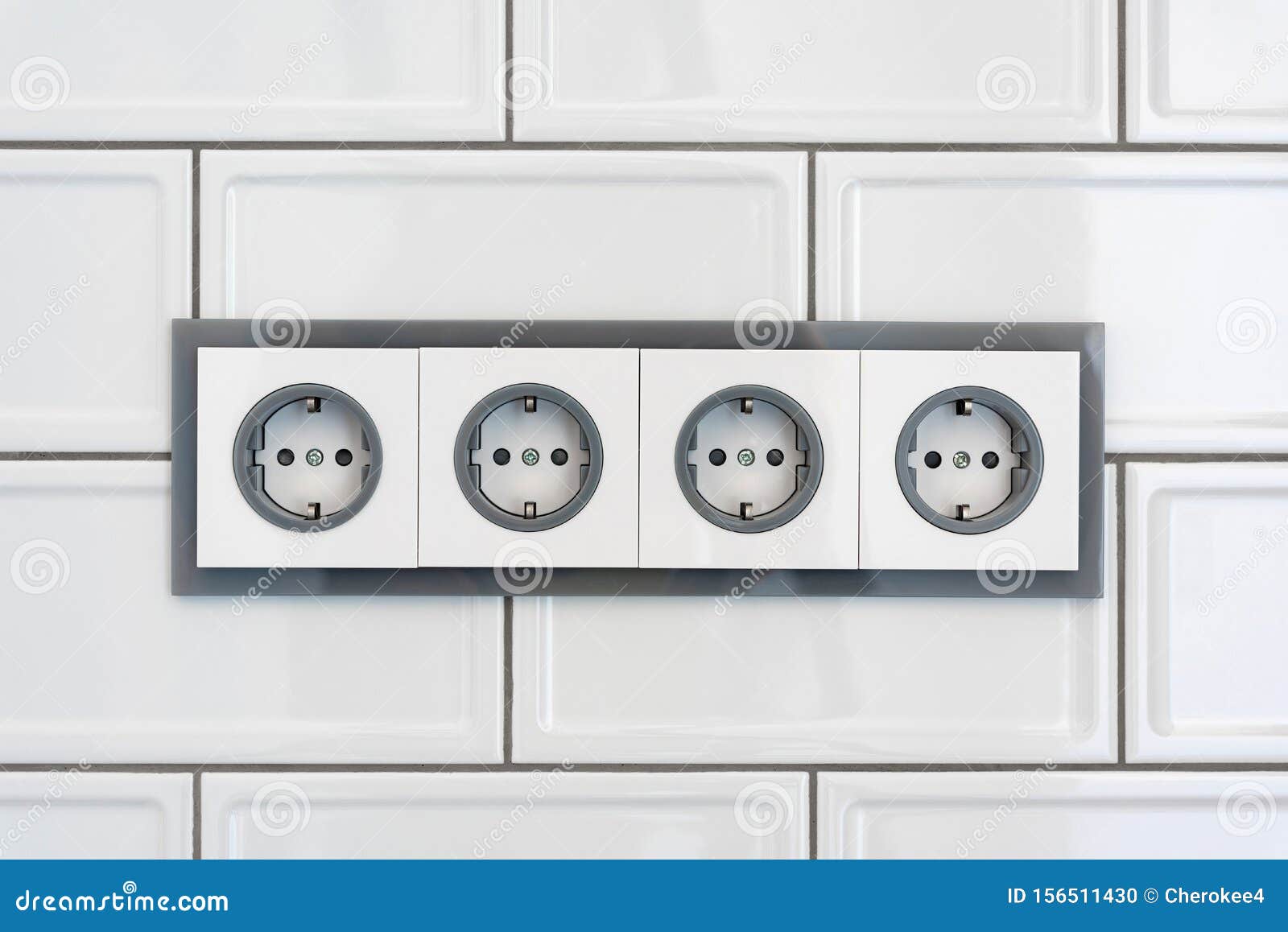 Installation Modern Sockets on a Tile Wall Close-up. Grey and White ...