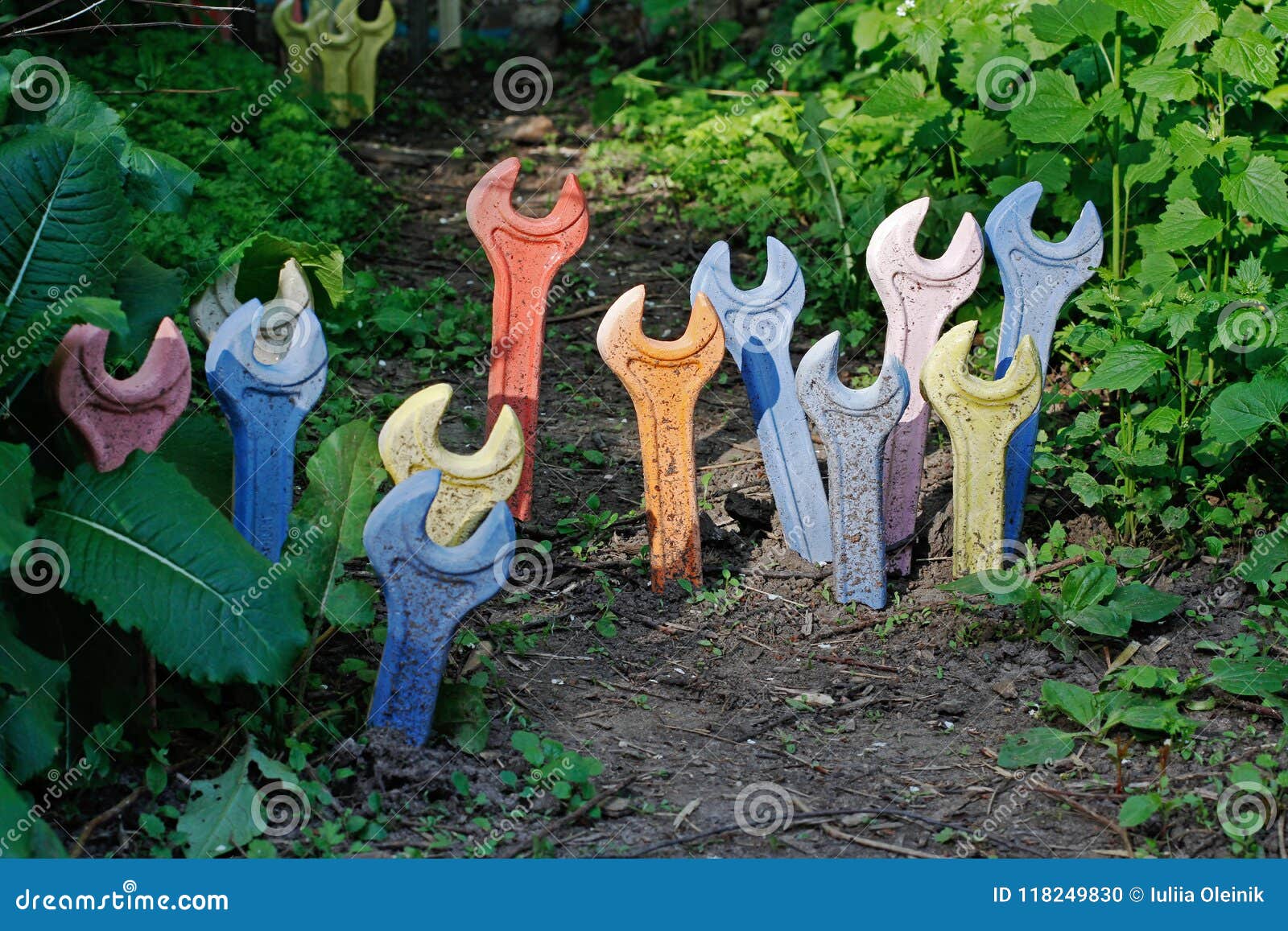 Installation of Multi-colored Spanners, Buried in the Ground Stock ...