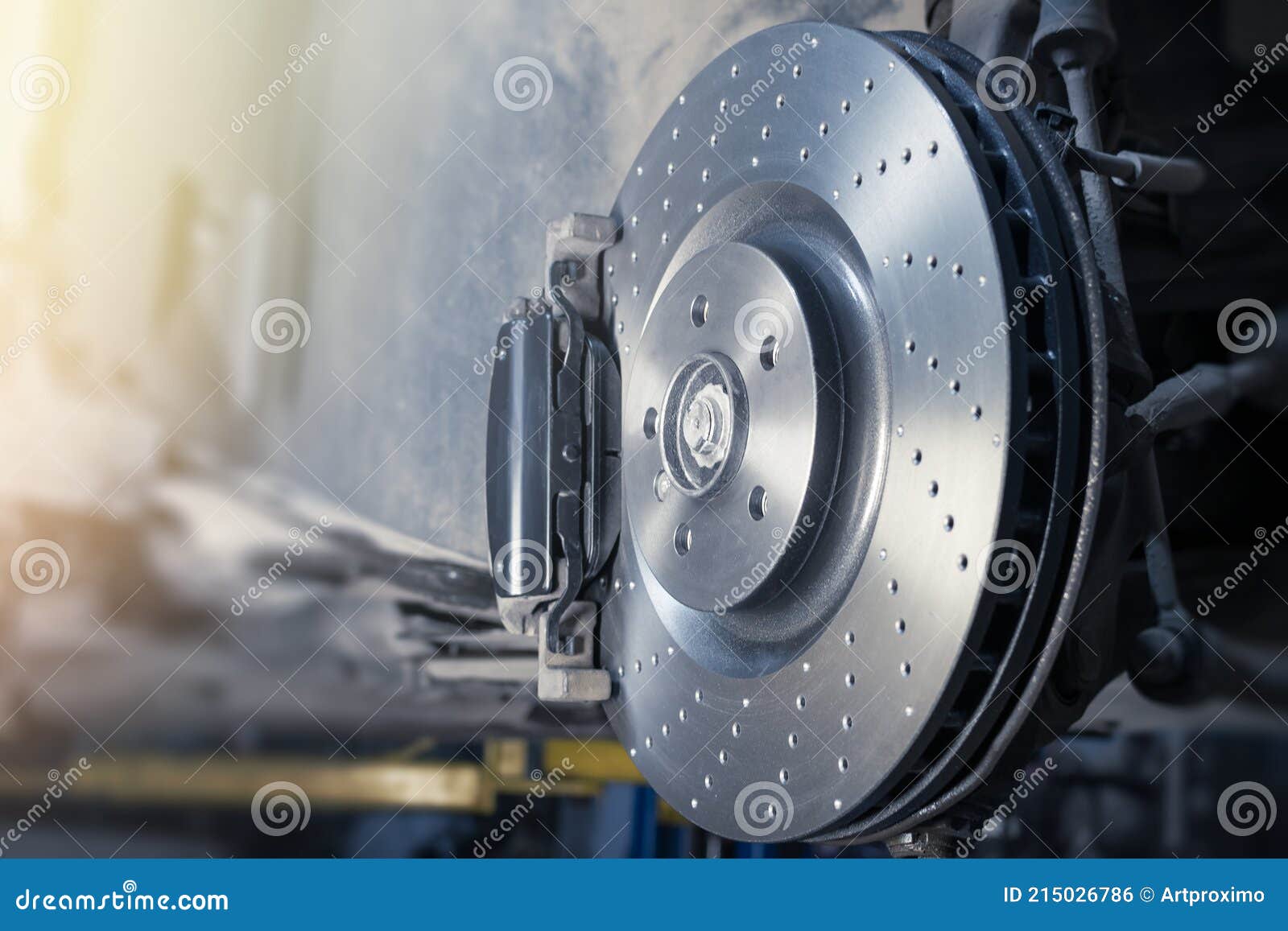 Installation of New Perforated Brake Discs and Pads on a Modern Auto in ...