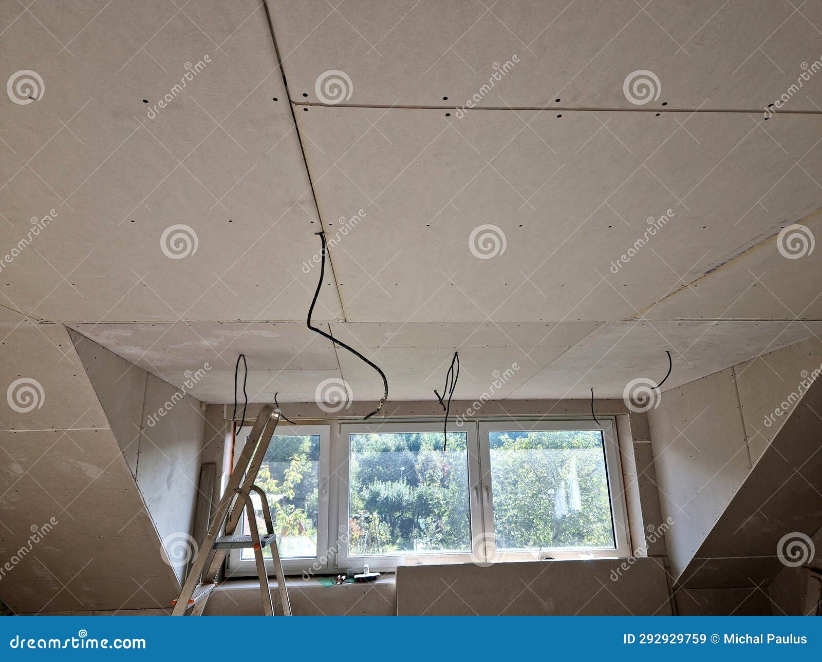 Installation of a Plasterboard Ceiling. Plaster is Glued with Paper ...