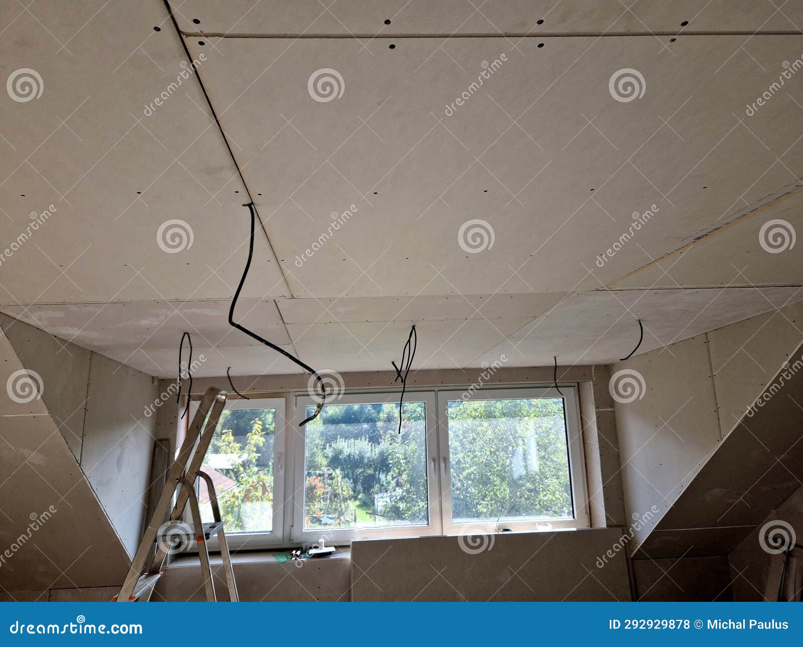 Installation of a Plasterboard Ceiling. Plaster is Glued with Paper ...
