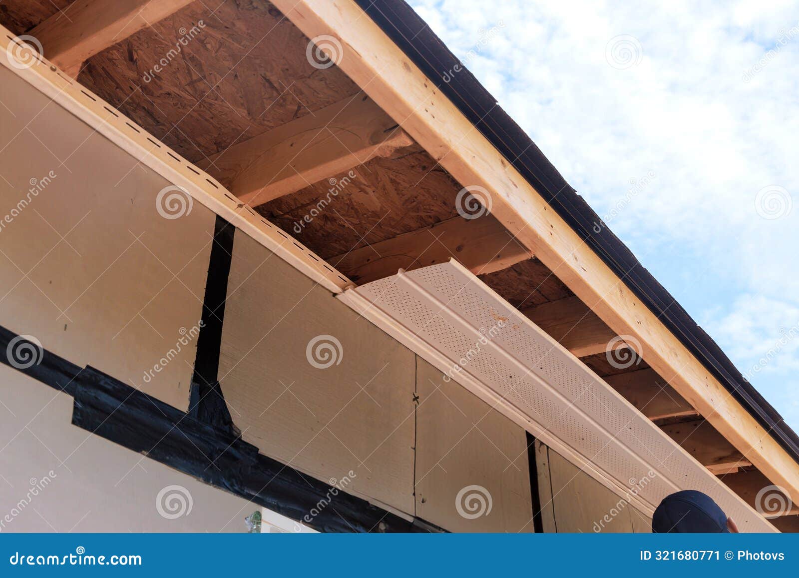 Installation Polyvinyl Soffit at Roof Corners of a House with Rafters ...