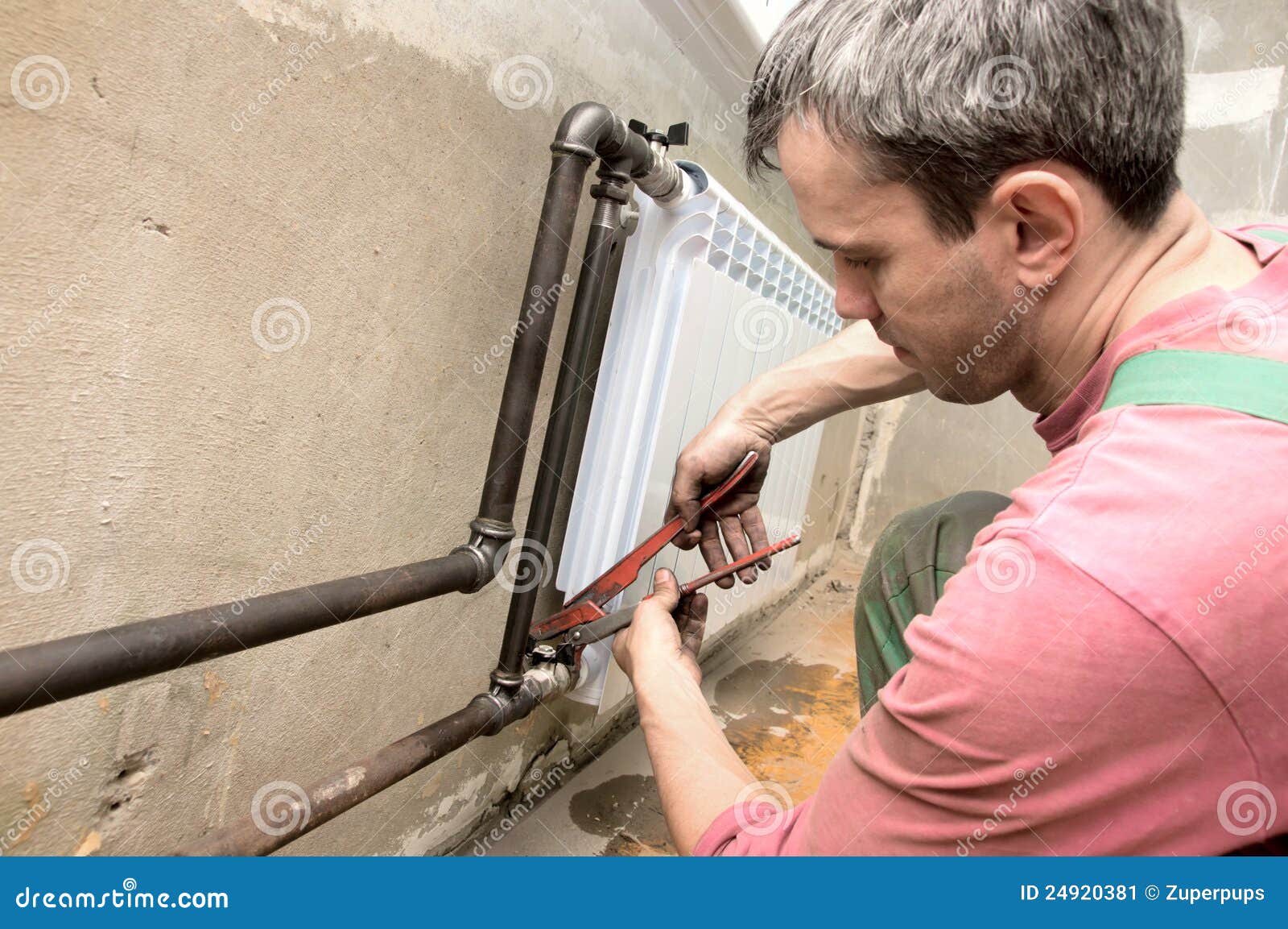 Installation of a radiator stock image. Image of industrial - 24920381
