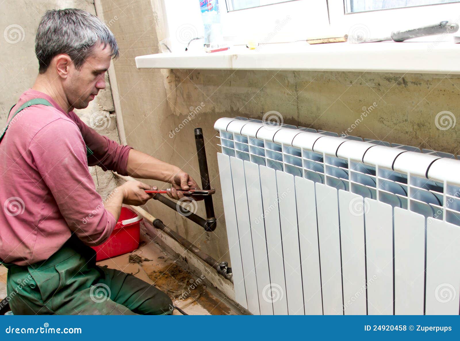 Installation of a radiator stock photo. Image of craftsman - 24920458