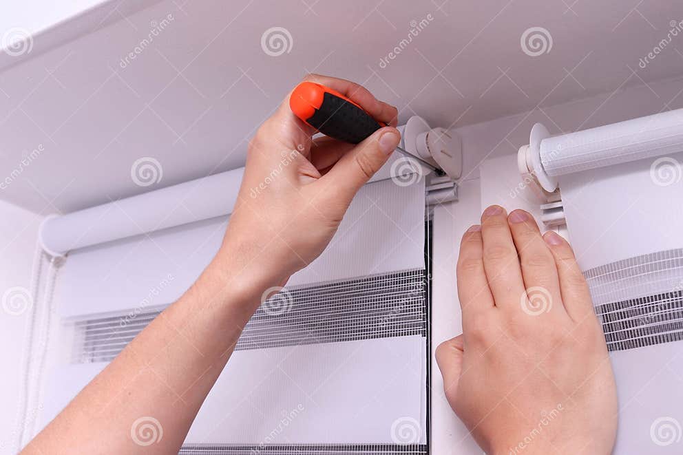 Installation of Roller Blinds on Windows. Man with Screwdriver ...