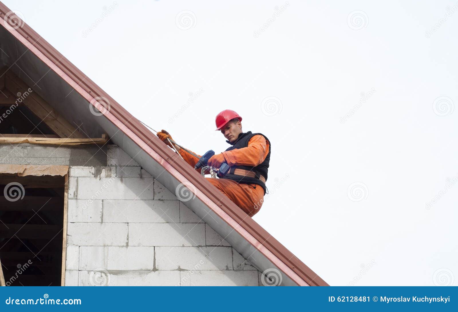 Installation of a roof stock image. Image of professional - 62128481