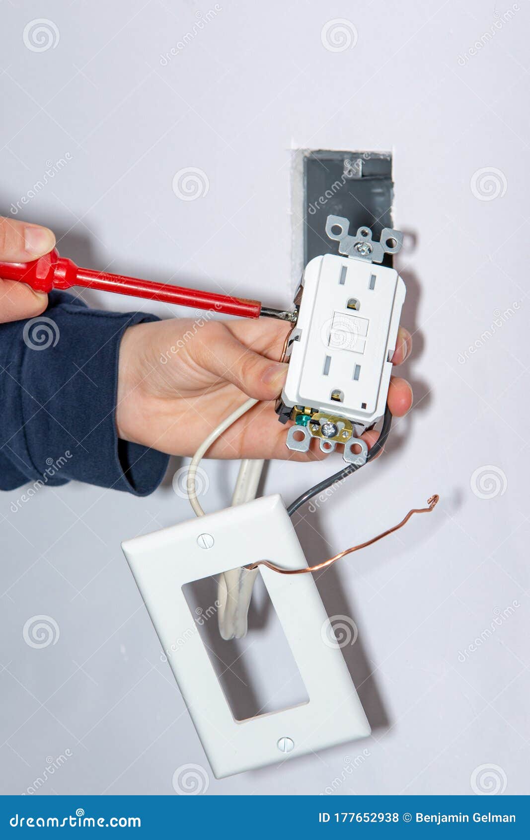 Installation of a Socket with a Fuse in a Drywall Stock Photo - Image ...