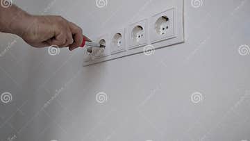 Installation of Socket Panels Using a Screwdriver and the Hands Stock ...