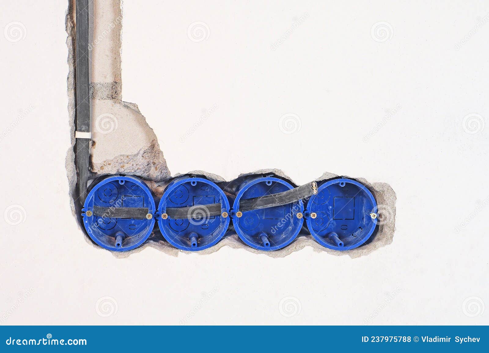 Installation of the Socket in a Wall with an Electric Wire. Stock Photo ...