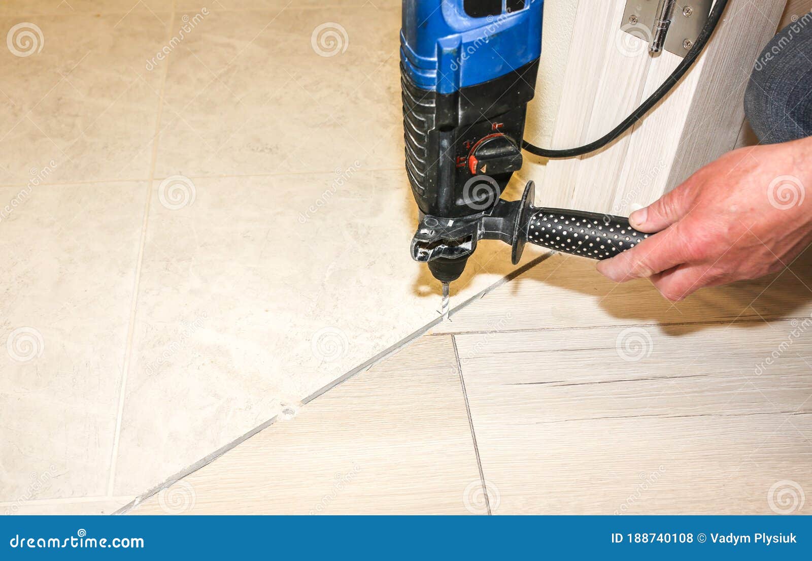 Installation of Threshold Indoors. Man with a Drill in Hands Stock ...