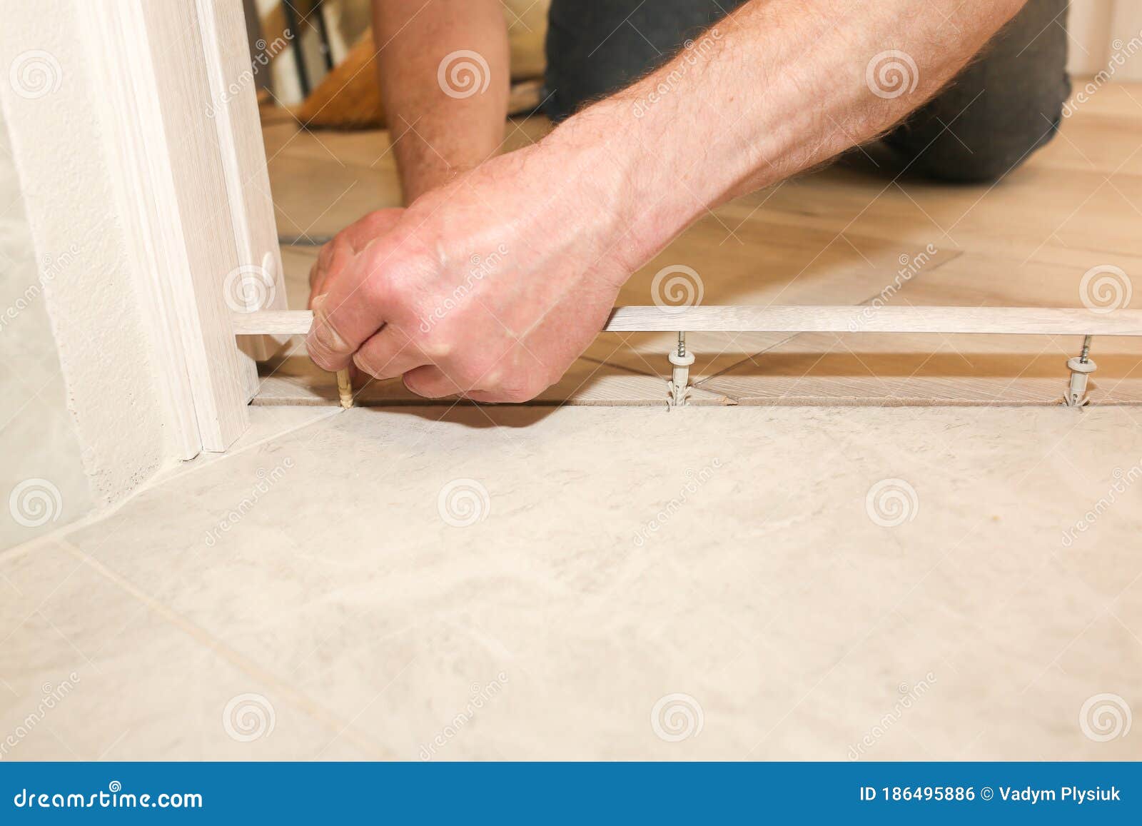 Installation of Threshold Indoors. Renovation Works in the Flat Stock ...