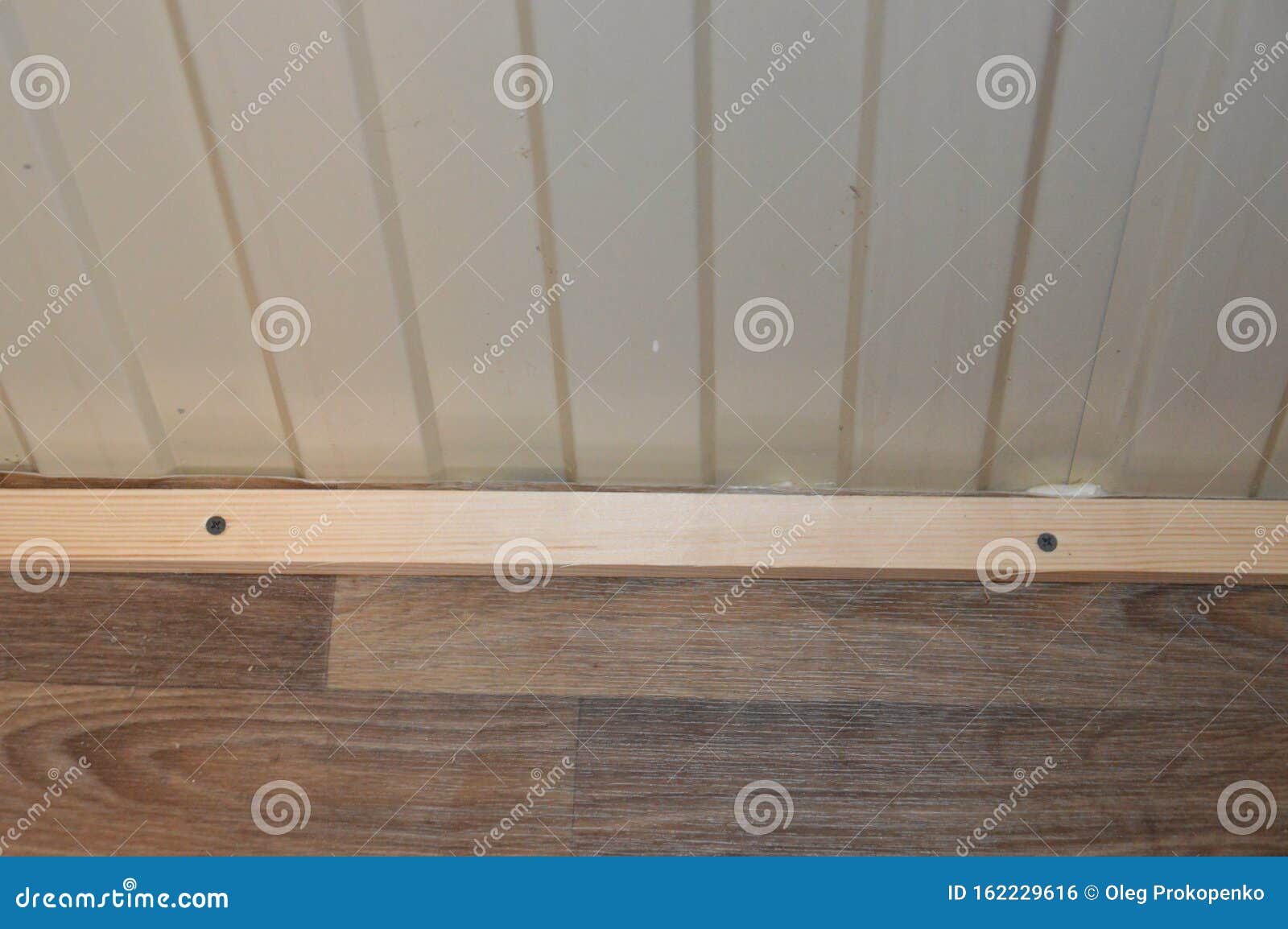 Installation of Thresholds and Baseboards in the Interior of a ...